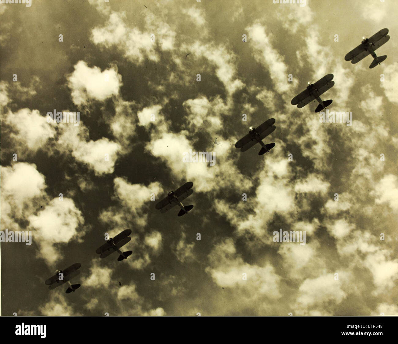 This photo shows a historic flight formation, with aircraft flying in ...