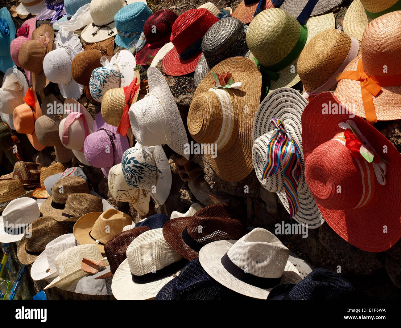 Many colourful colorful hats in rows on display at street stall in ...