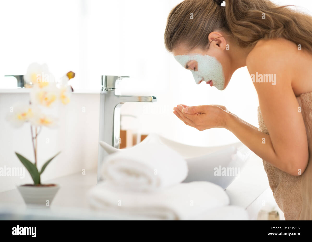 Woman washing face mask hi-res stock photography and images - Alamy