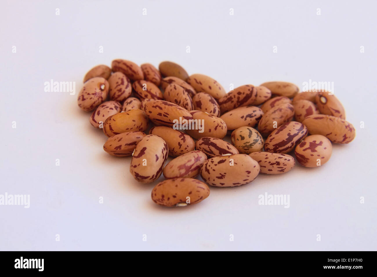 Orange beans on white background with heart shape Stock Photo - Alamy