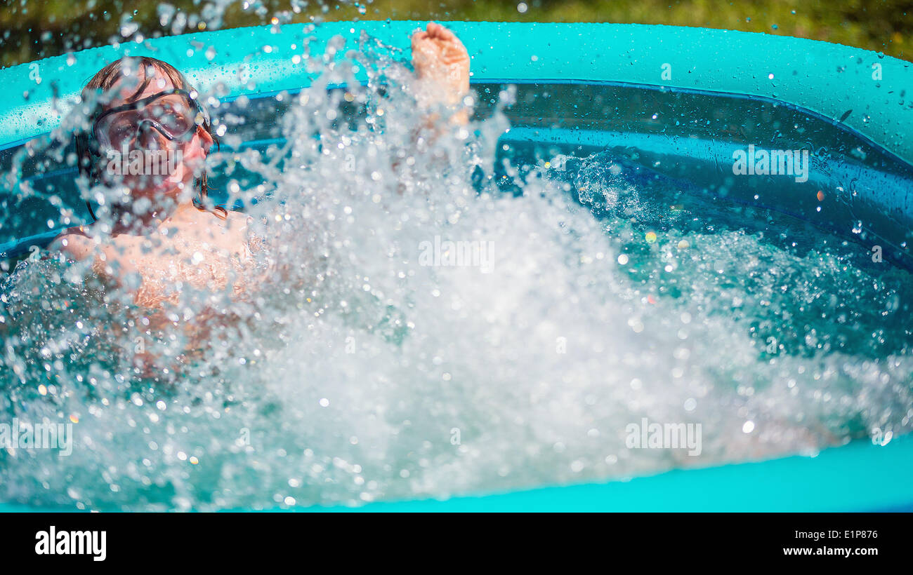 Berlin, Germany. 08th June, 2014. Children play in a paddling pool in ...