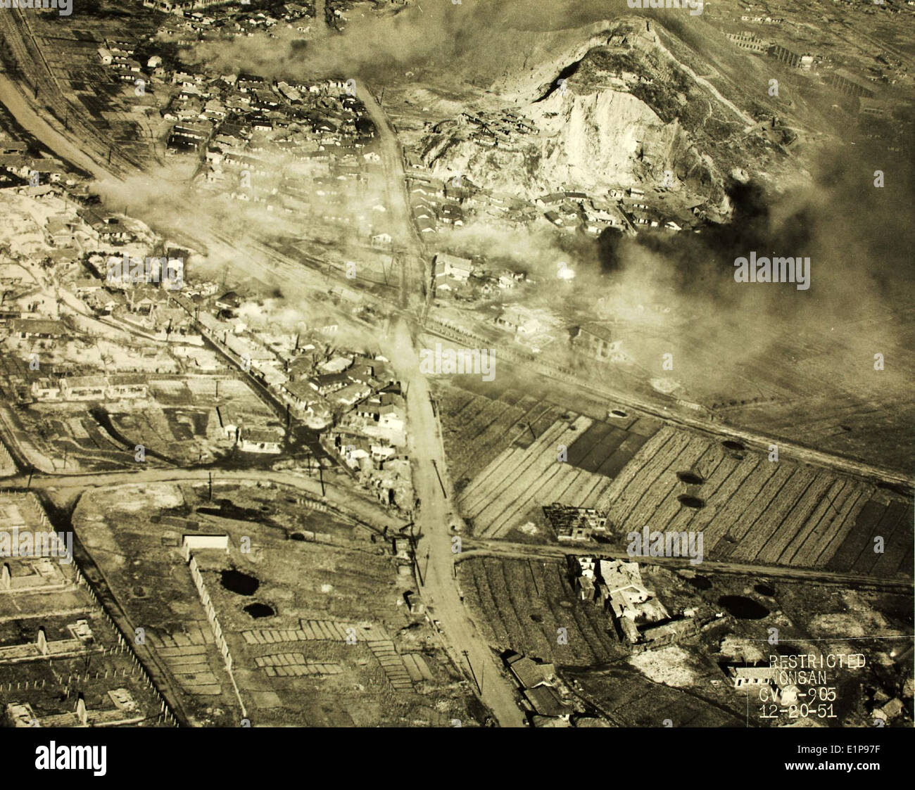 This photograph captures a scene from the Korean War (1950-1954), a ...