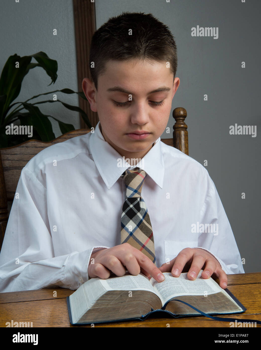 A young boy studying the scriptures Stock Photo - Alamy