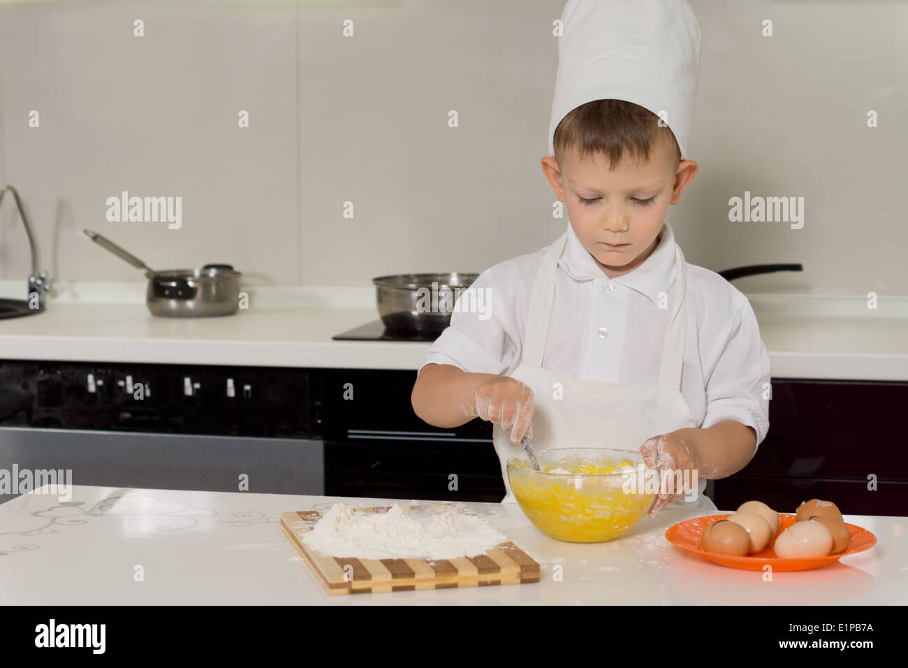 Child Mixing Flour And Eggs Stock Photos & Child Mixing Flour And Eggs ...