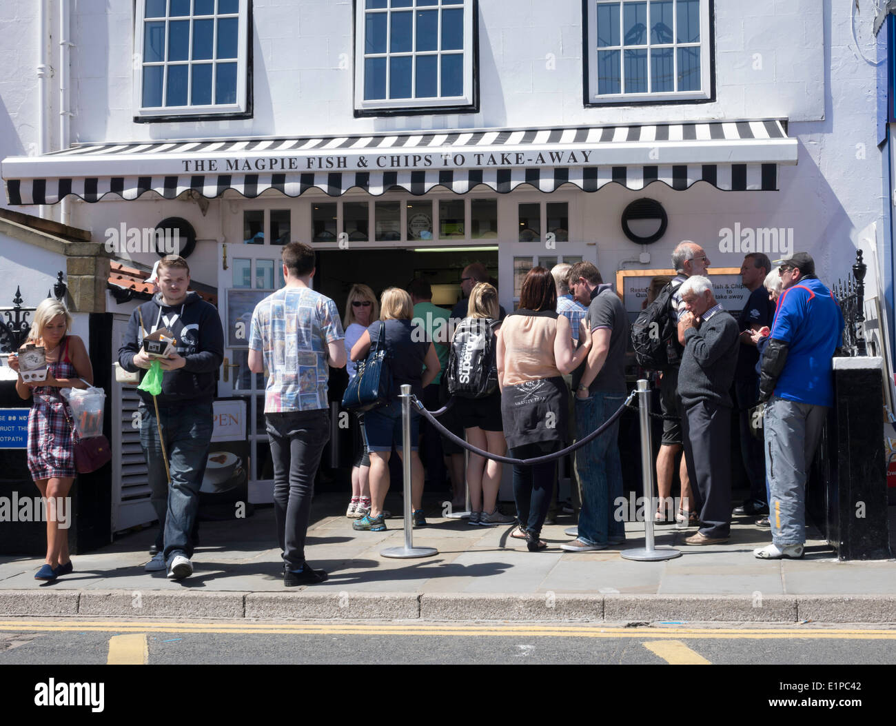 A queue waiting for take-away fish and chips at the famous Magpie Café ...