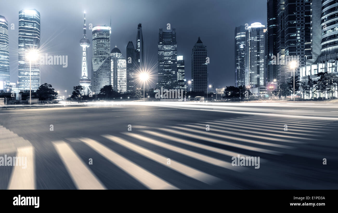 The light trails on the modern building background in shanghai china ...