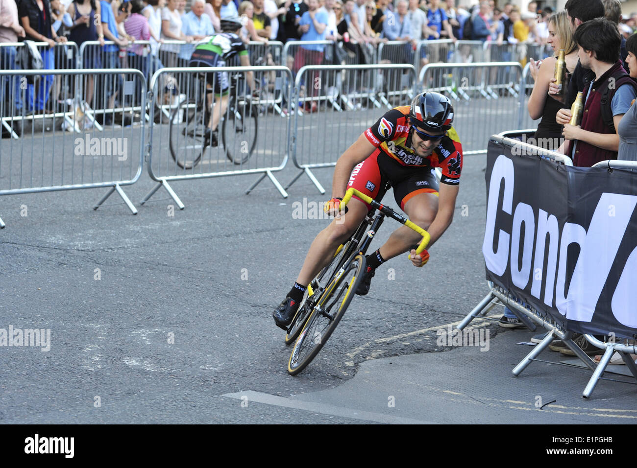 A rider on the Condor Track Bike Criterium Bike Race cornering hard out ...