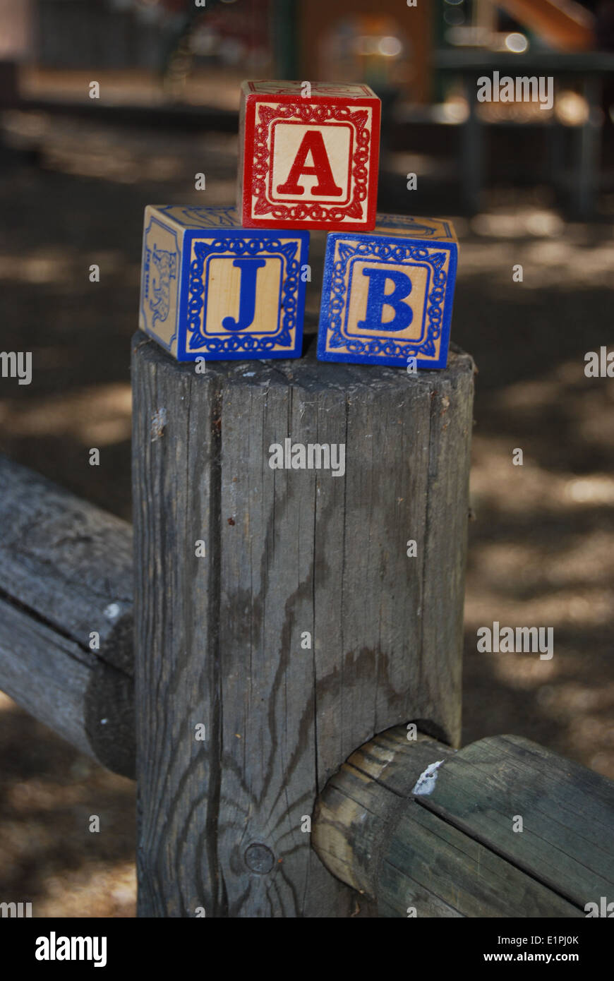 Letter blocks on post Stock Photo - Alamy