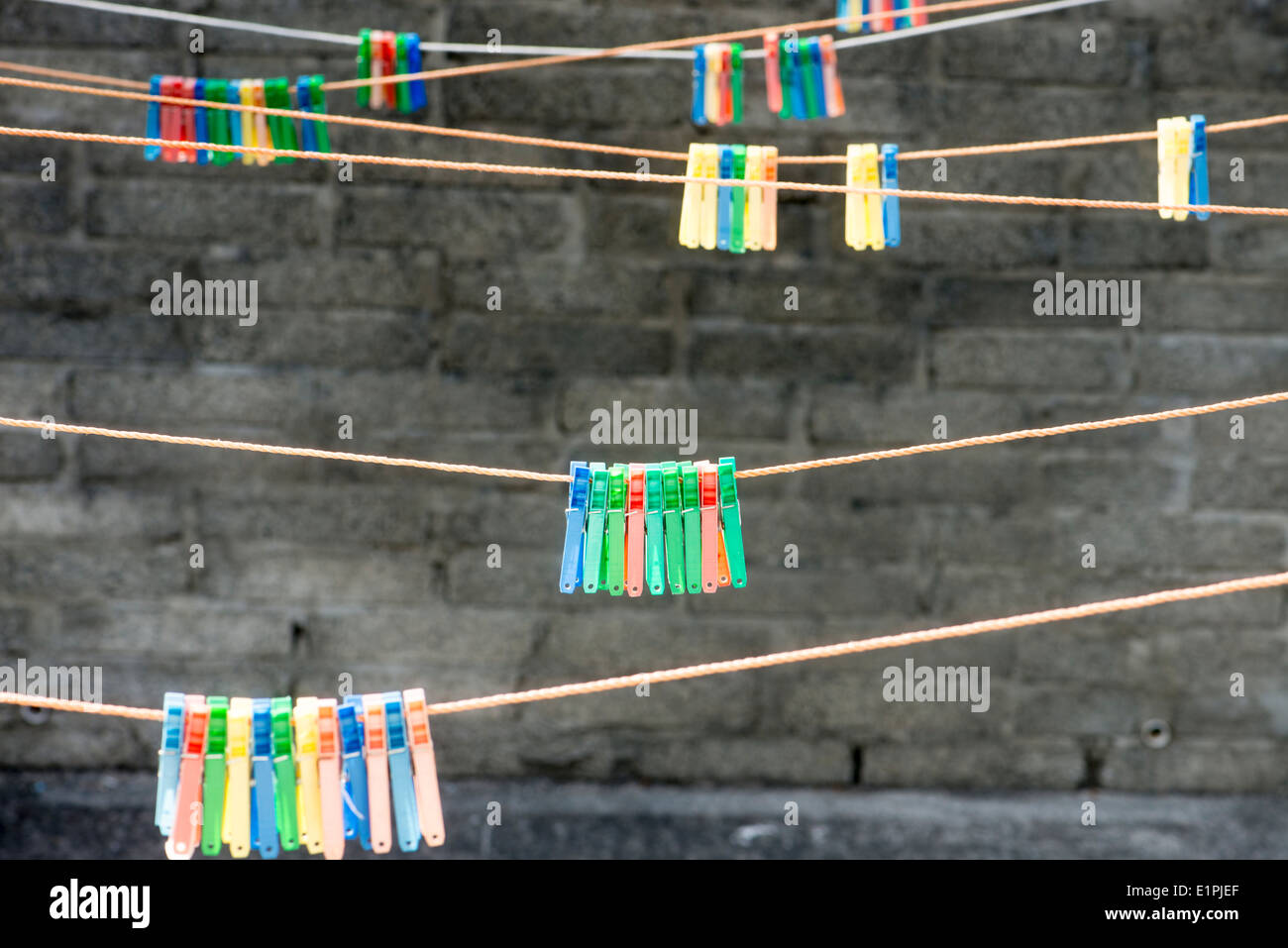 Pegs on a clothesline Stock Photo - Alamy