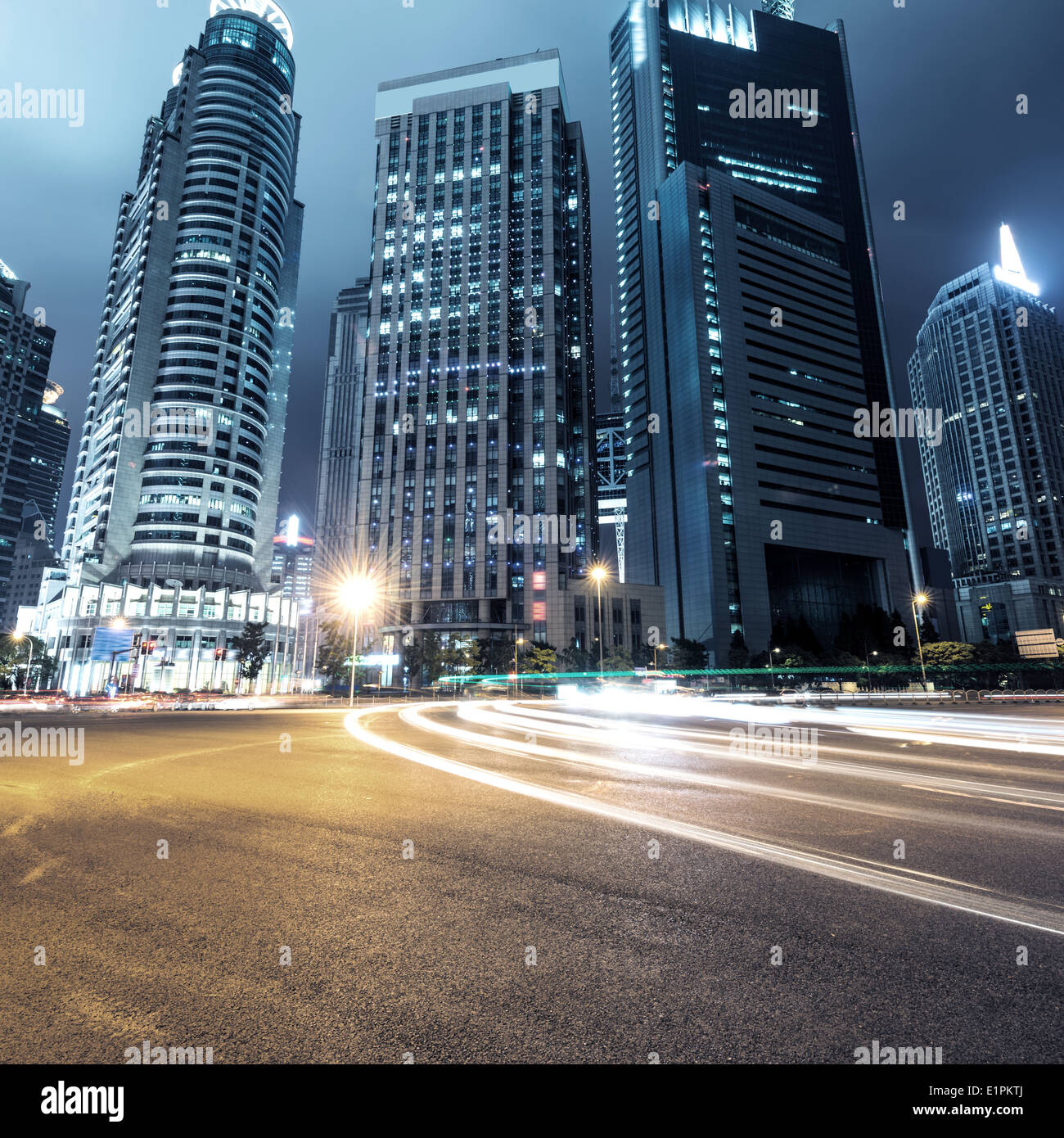 The light trails on the modern building background in shanghai china ...