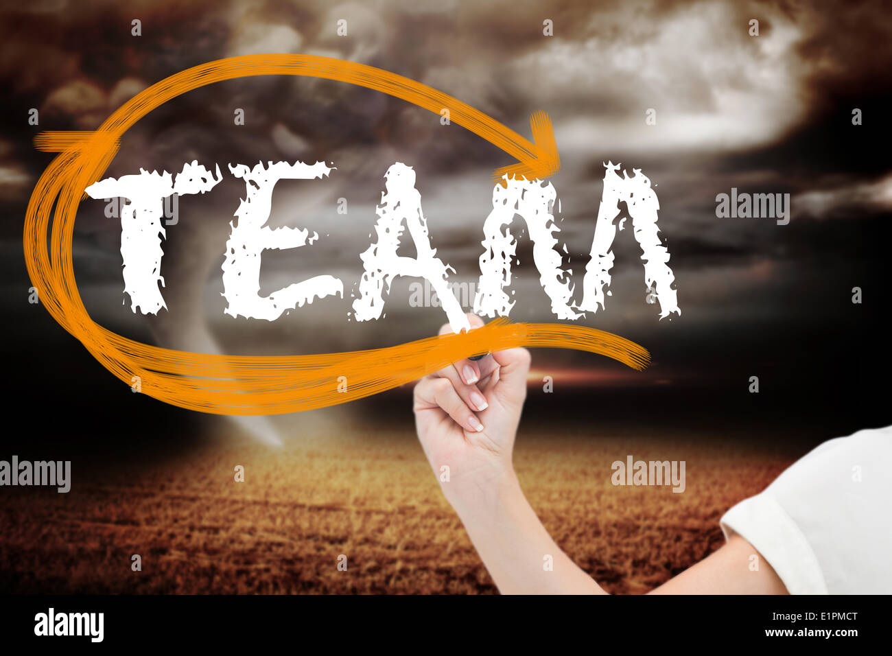 Businesswoman writing the word team Stock Photo - Alamy