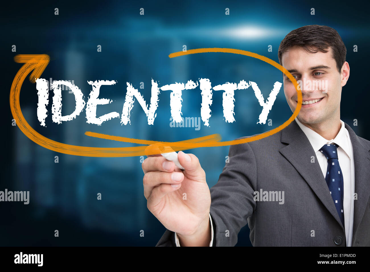 Businessman writing the word identity Stock Photo - Alamy