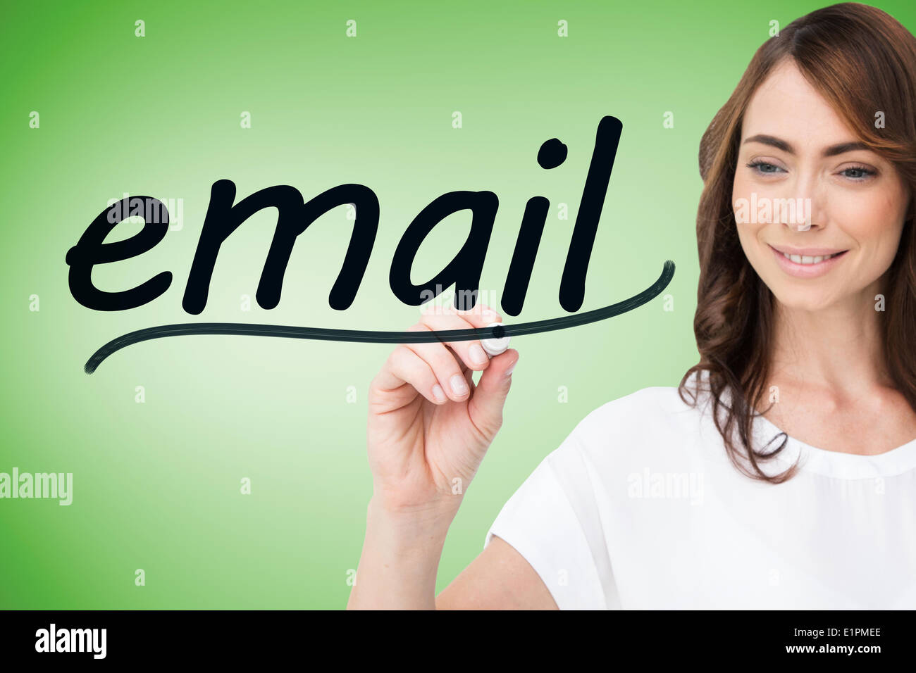 Businesswoman writing the word email Stock Photo - Alamy