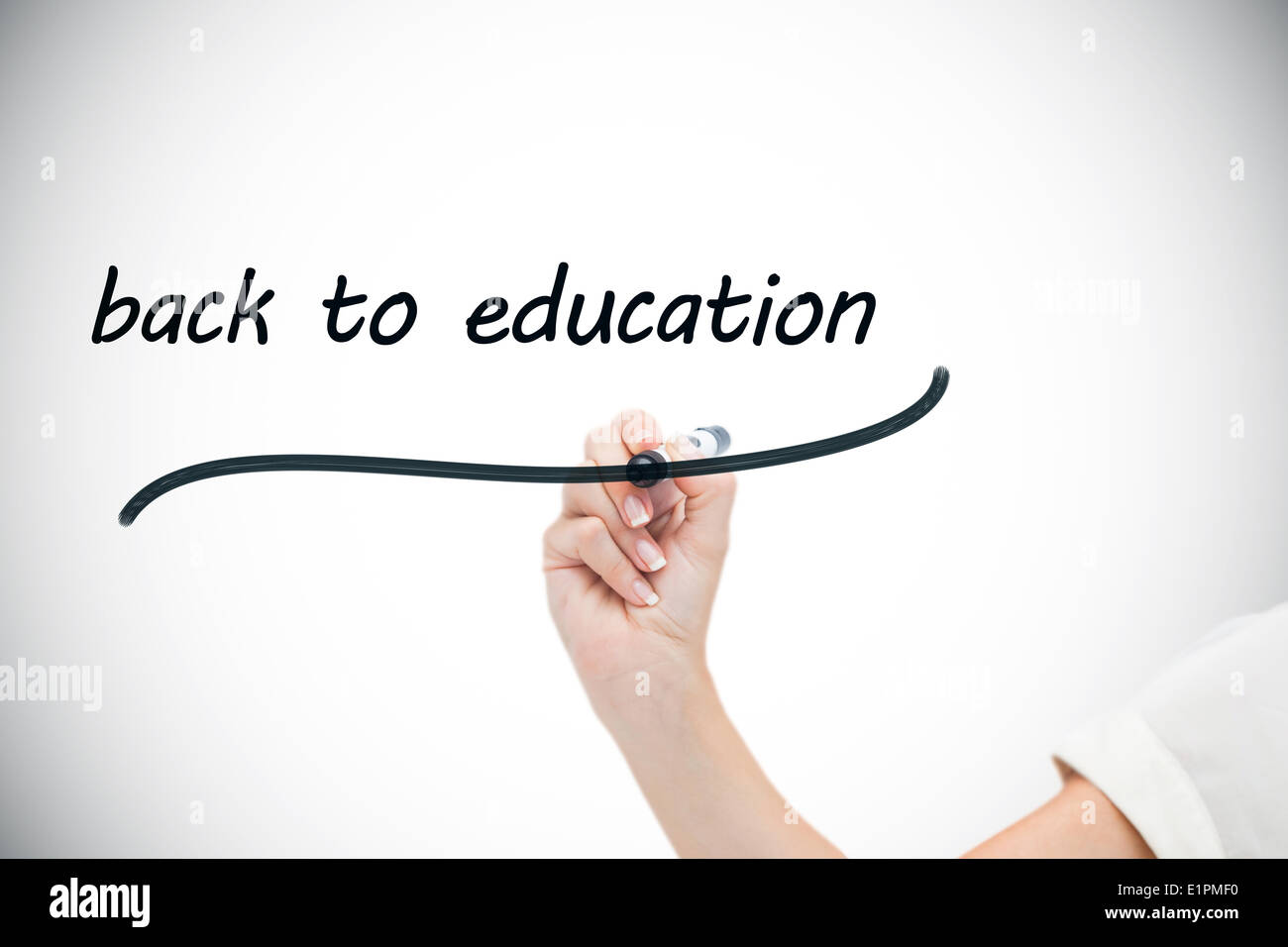 Businesswoman writing the words back to education Stock Photo - Alamy