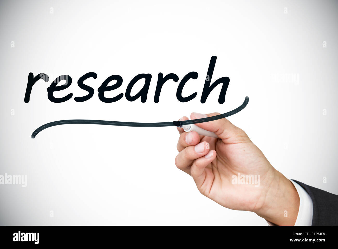 Businessman writing the word research Stock Photo - Alamy