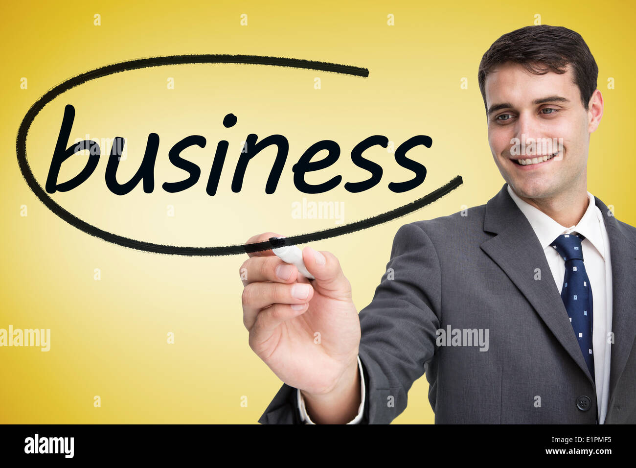 Businessman writing the word business Stock Photo - Alamy
