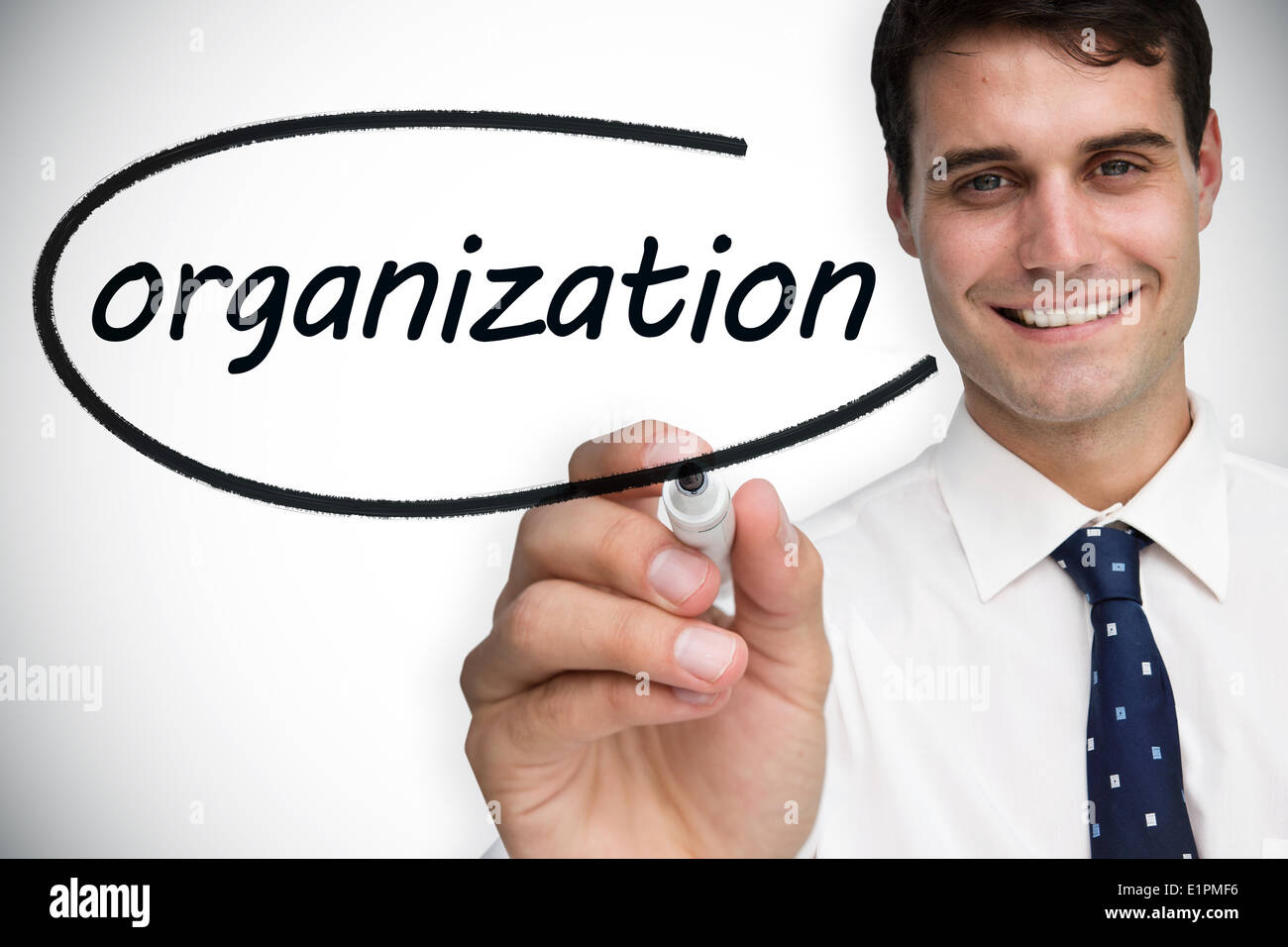 Businessman writing the word organization Stock Photo - Alamy