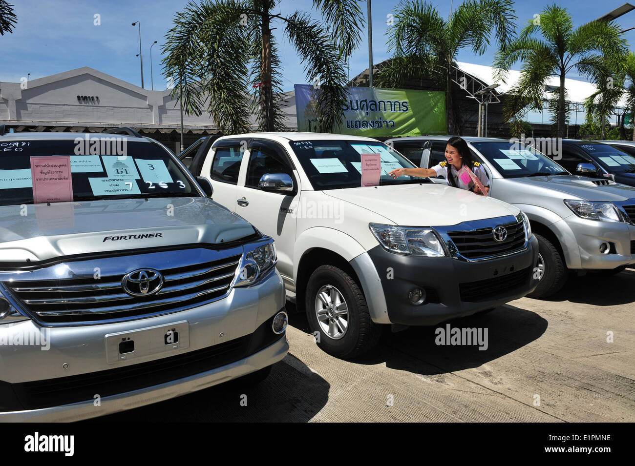 Bangkok, Thailand. 9th June, 2014. A Thai customs official sets a label ...