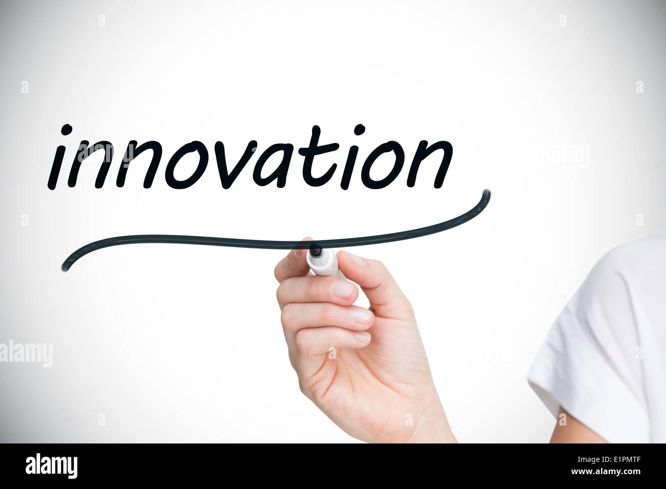 Businesswoman writing the word innovation Stock Photo - Alamy