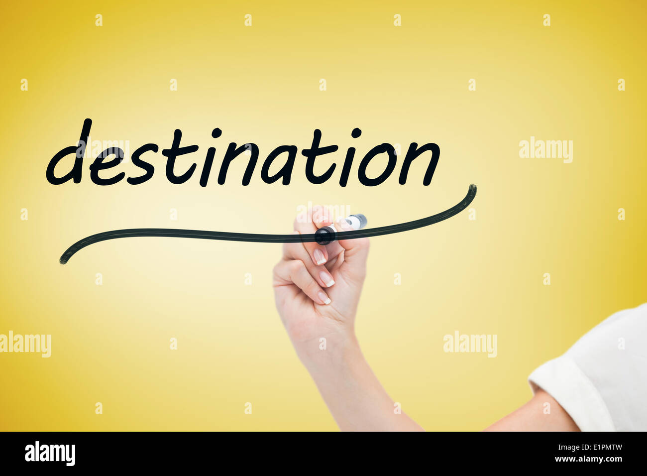 Businesswoman writing the word destination Stock Photo - Alamy