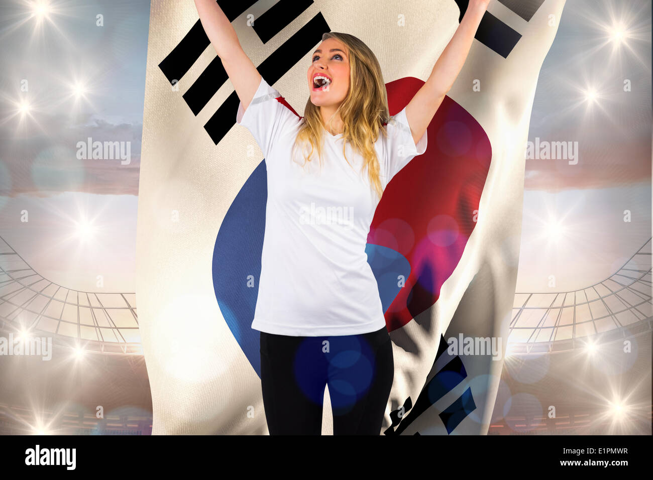 Composite image of pretty football fan in white cheering holding korea ...