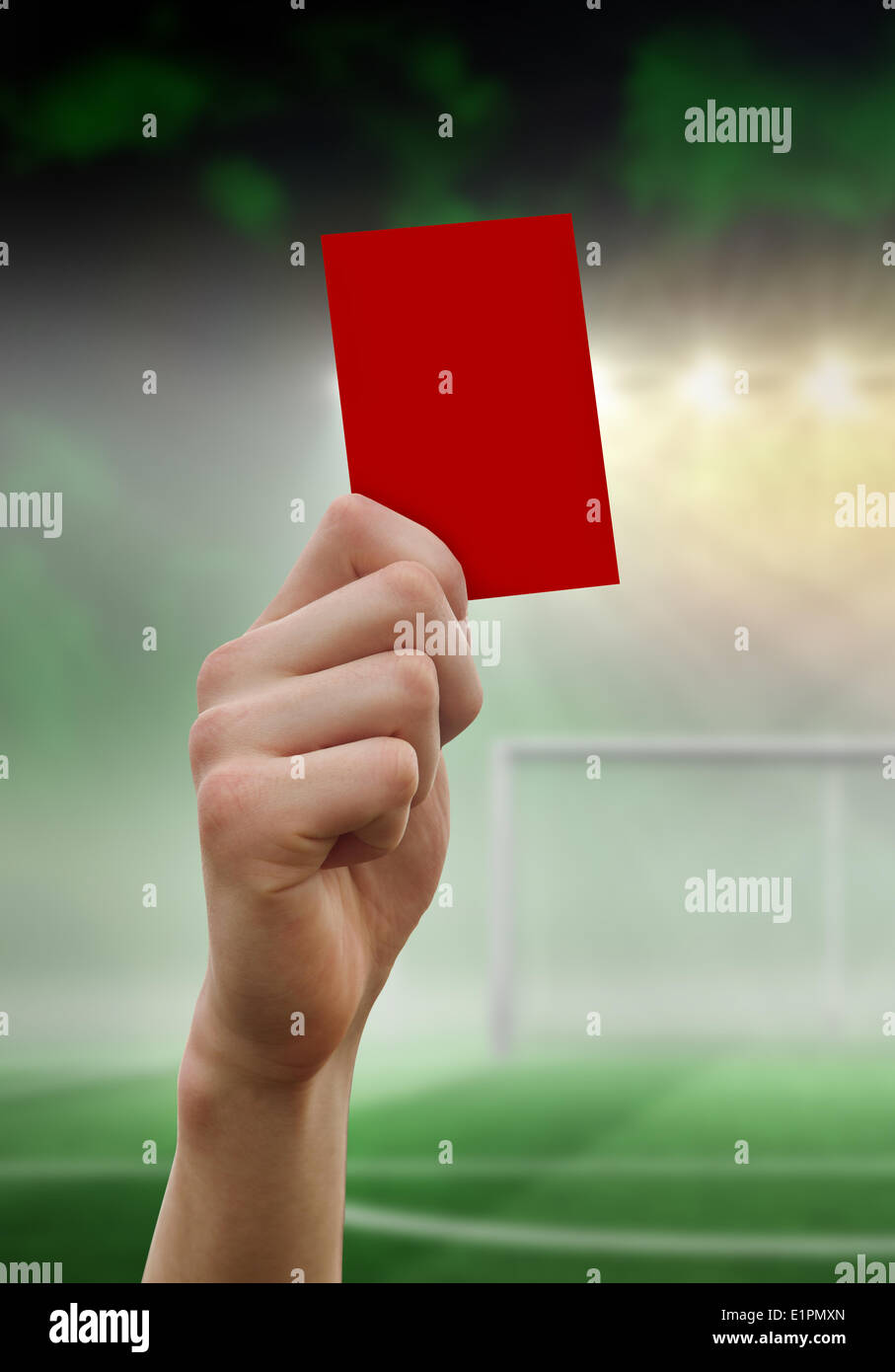 Composite image of hand holding up red card Stock Photo - Alamy