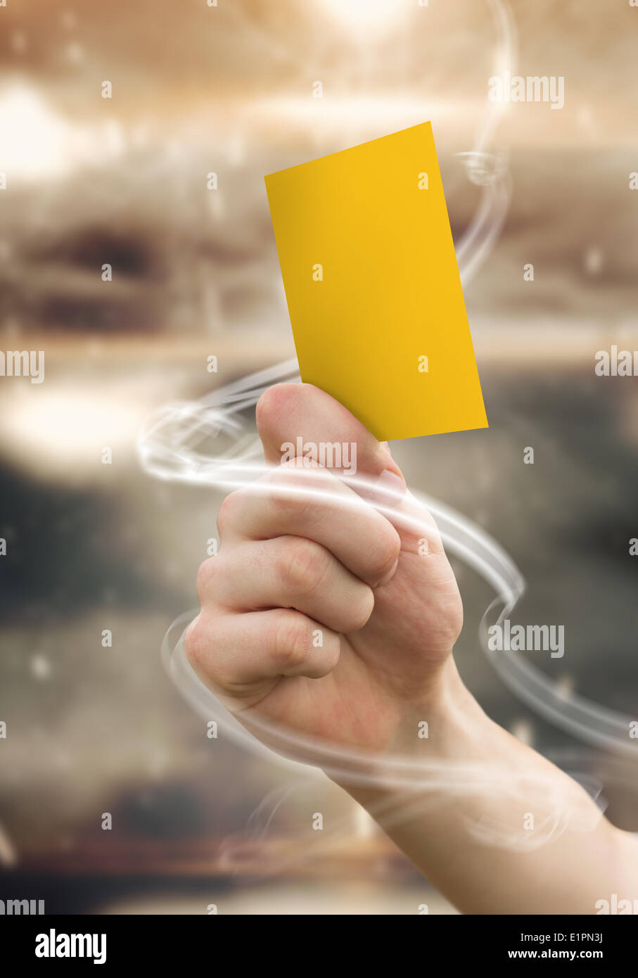 Composite image of hand holding up yellow card Stock Photo - Alamy
