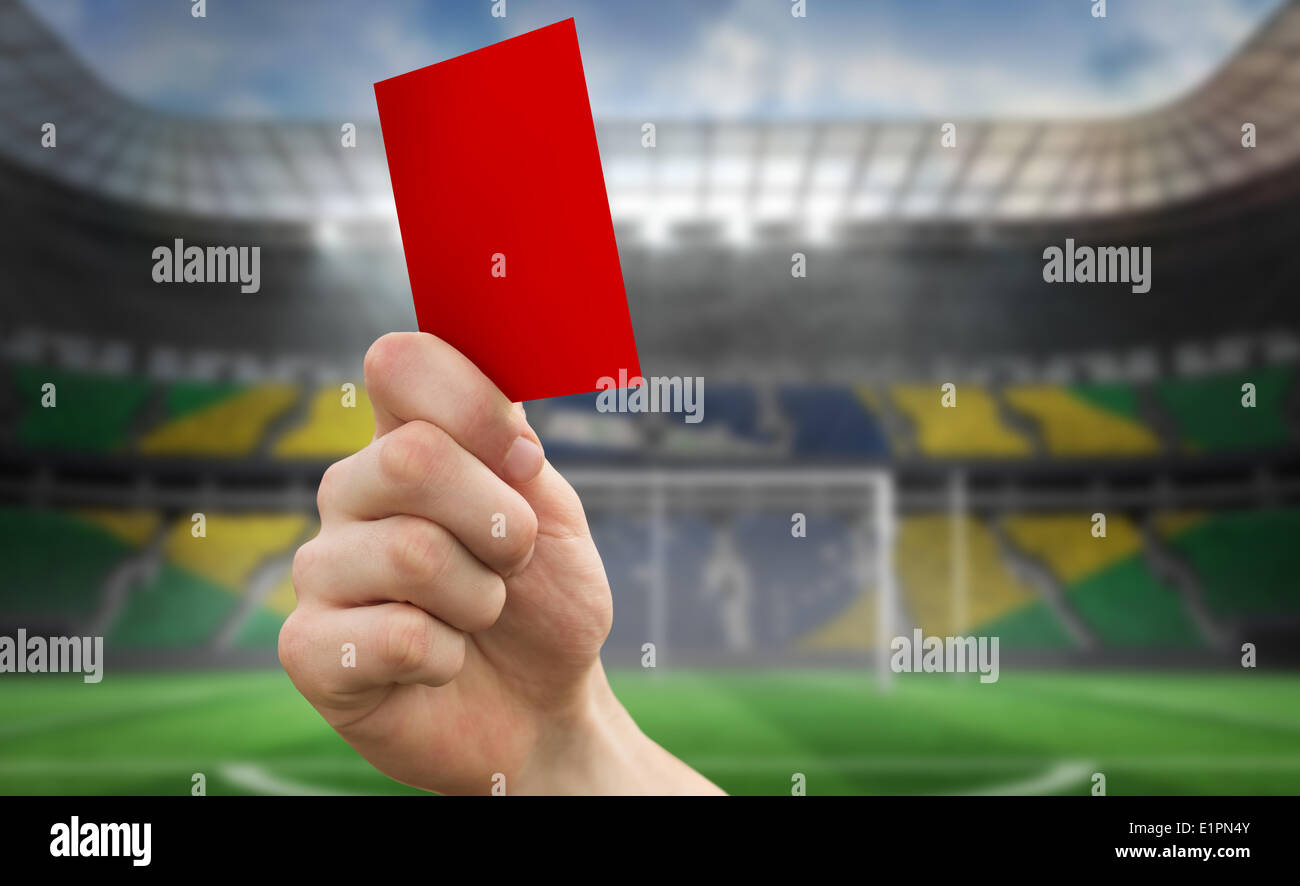 Composite image of hand holding up red card Stock Photo - Alamy