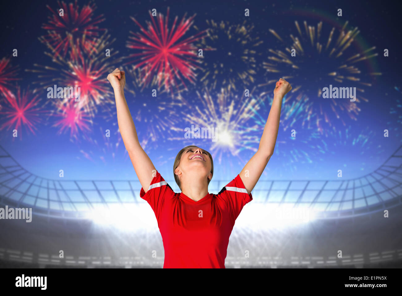 Composite image of cheering football fan in red Stock Photo - Alamy