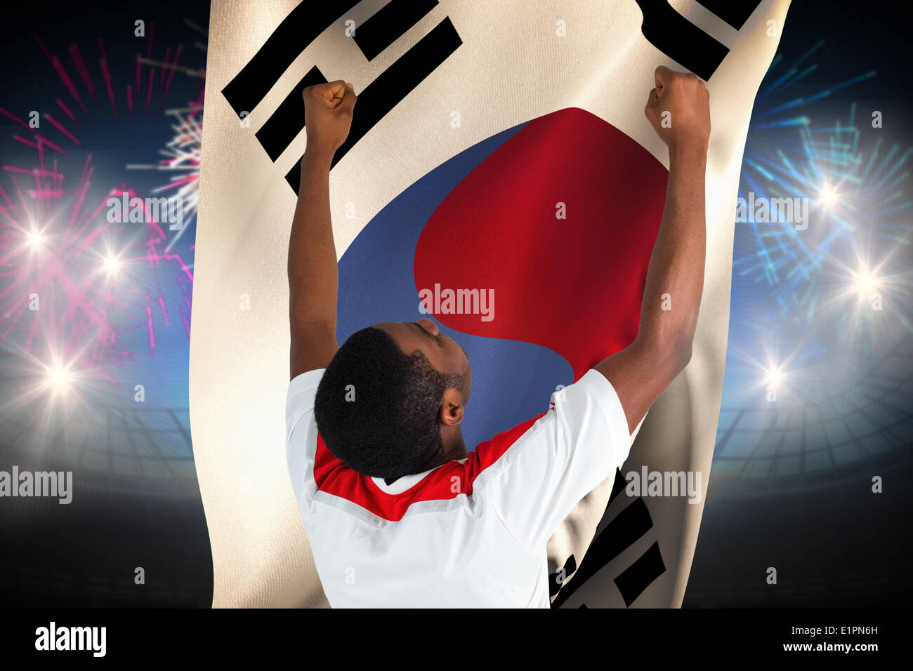 Composite image of excited handsome football fan cheering Stock Photo ...