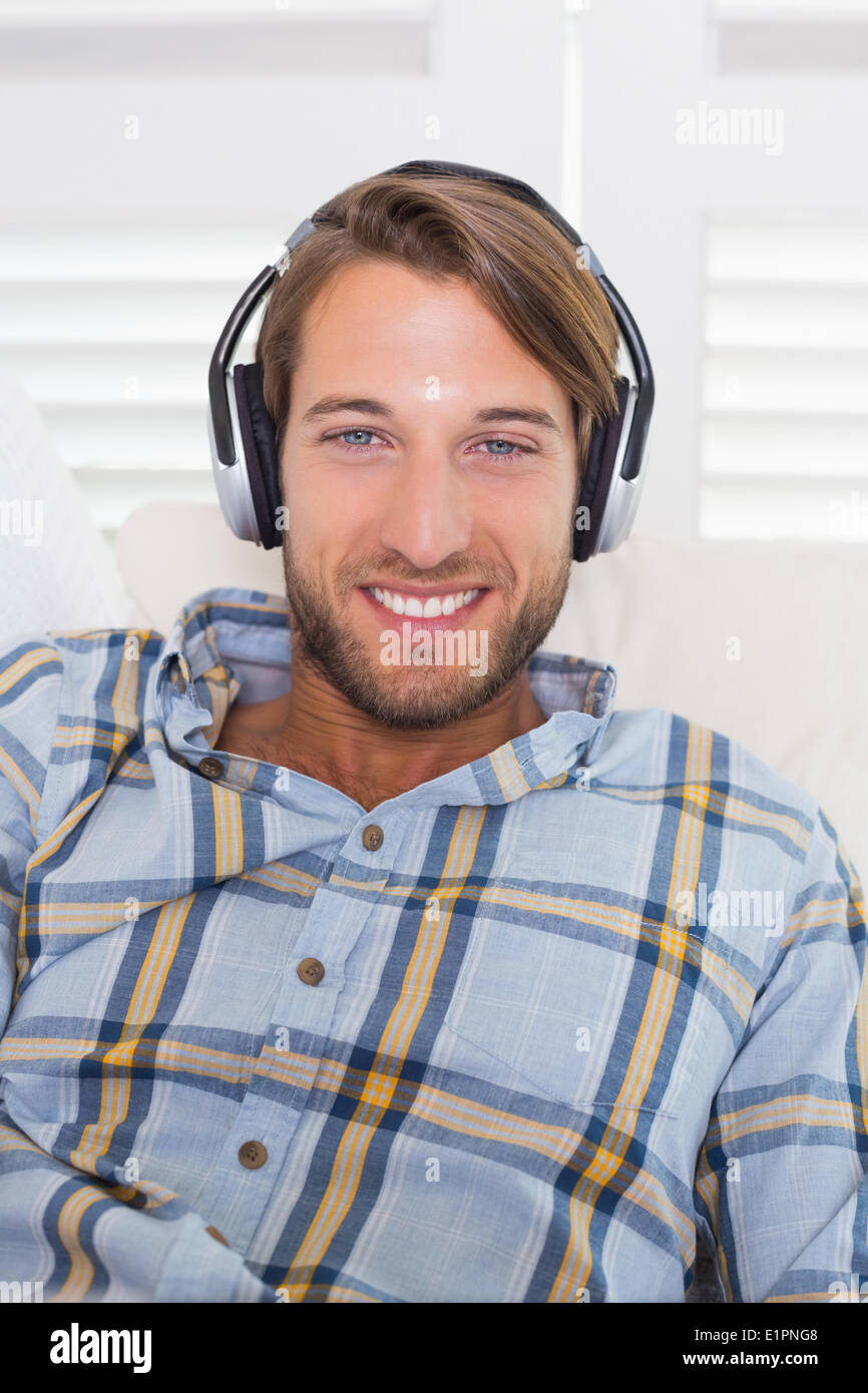 Man listening music lying on hi-res stock photography and images - Alamy