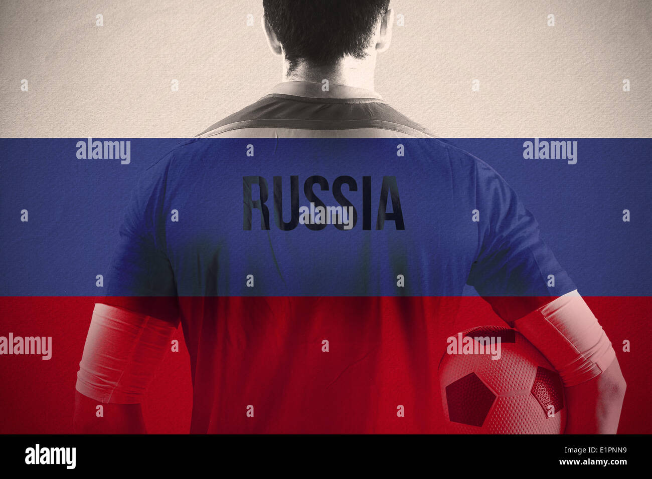 Composite image of russia football player holding ball Stock Photo - Alamy