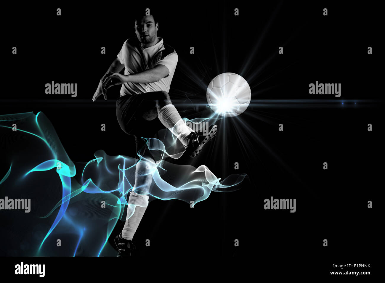 Composite image of football player in white kicking Stock Photo - Alamy