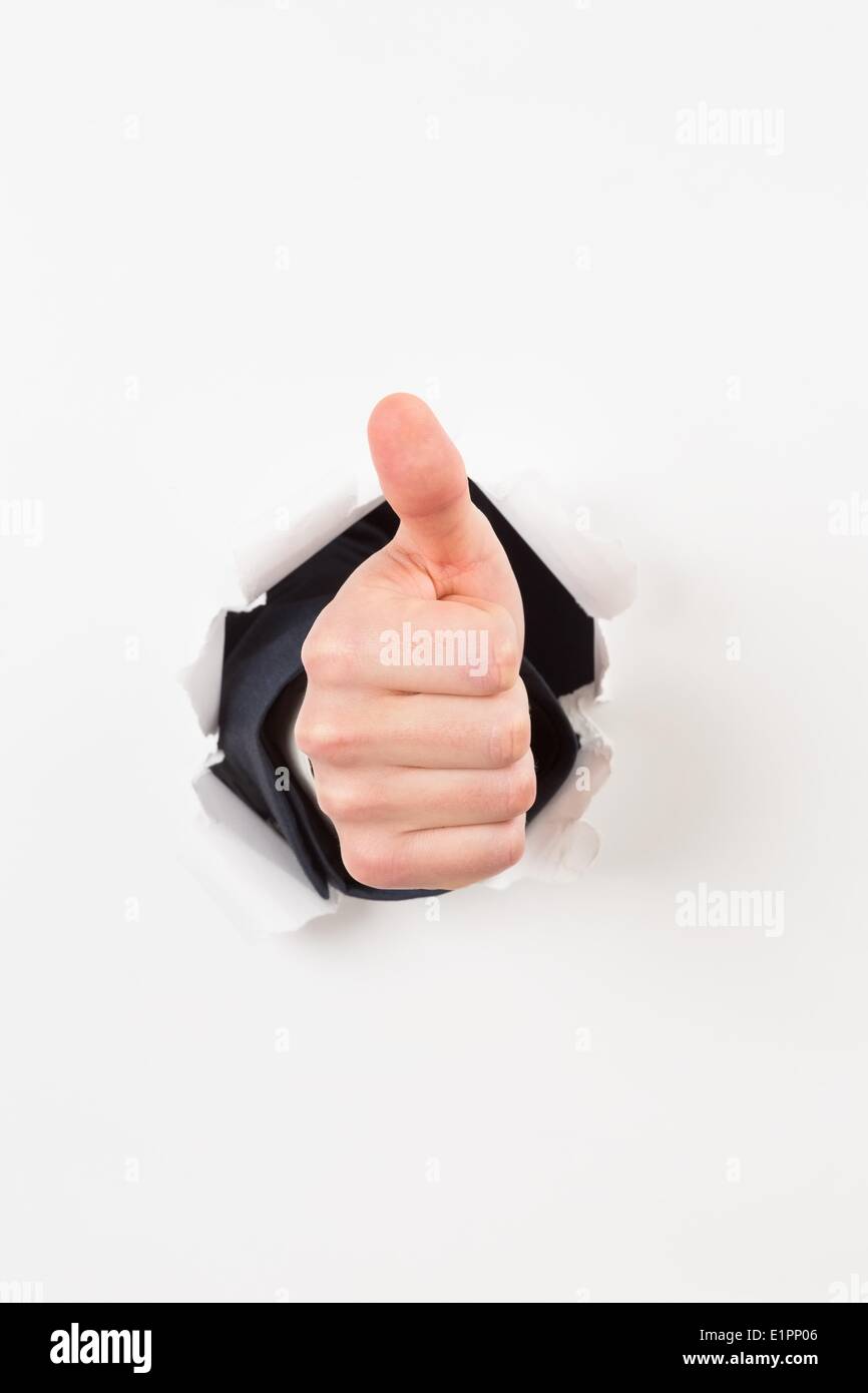 Bursting through paper Cut Out Stock Images & Pictures - Alamy