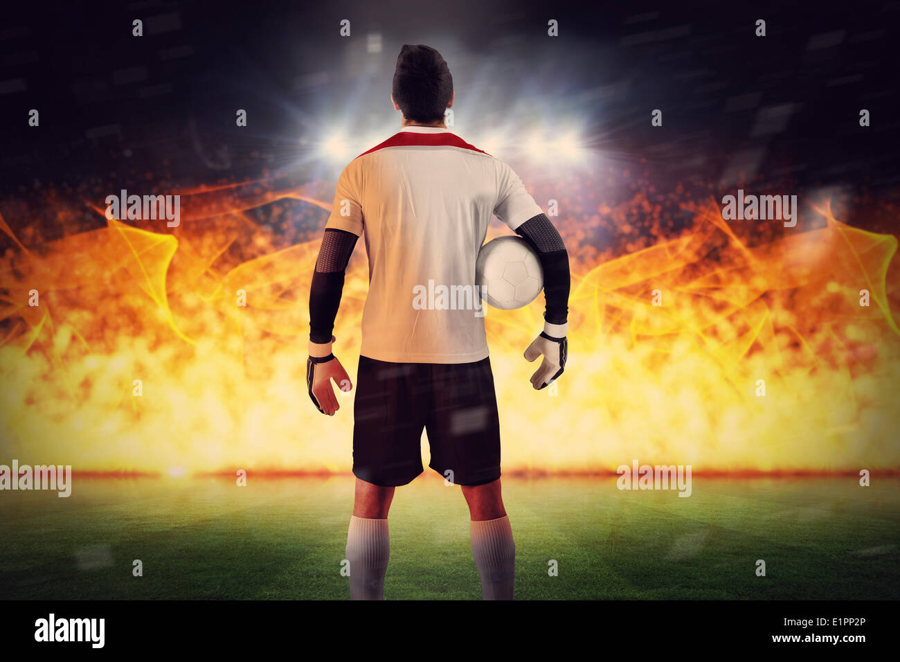 Composite image of goalkeeper standing in white jersey Stock Photo - Alamy
