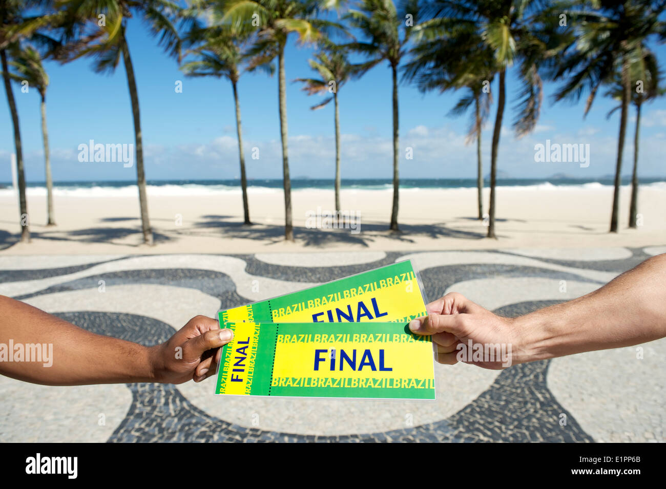 Hands holding two Brazil final tickets to football soccer event in ...