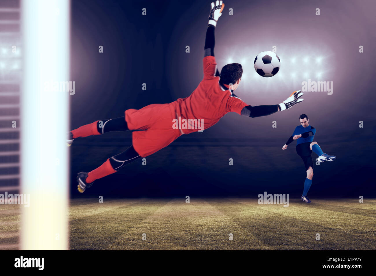 Composite image of fit goal keeper jumping up Stock Photo - Alamy