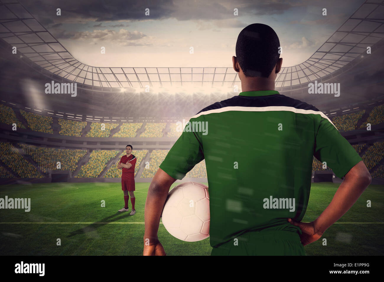 Football players facing off in large stadium Stock Photo - Alamy