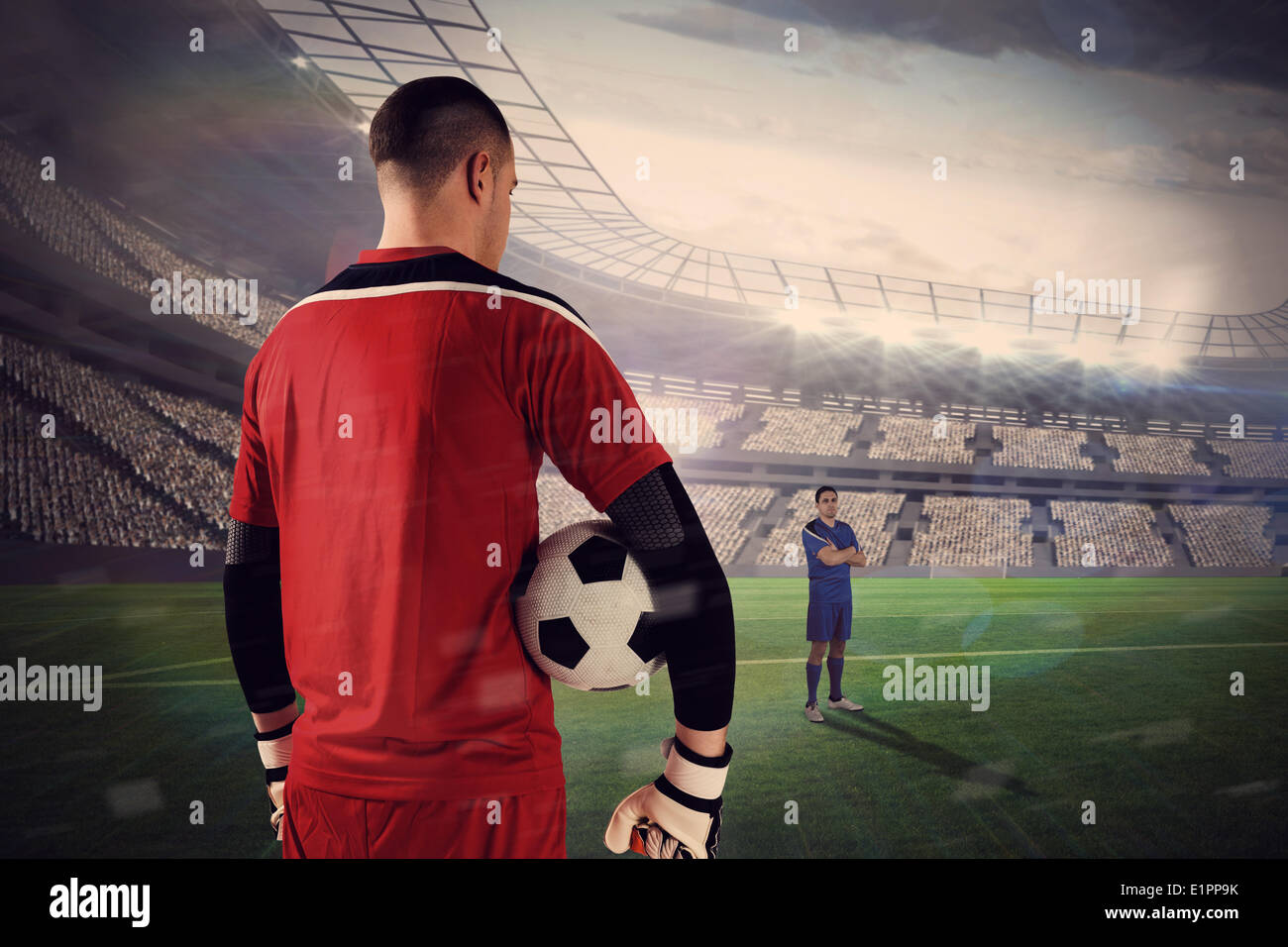 Football players facing off in large stadium Stock Photo - Alamy
