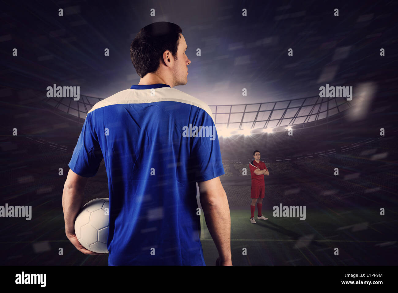 Football players facing off in large stadium Stock Photo - Alamy