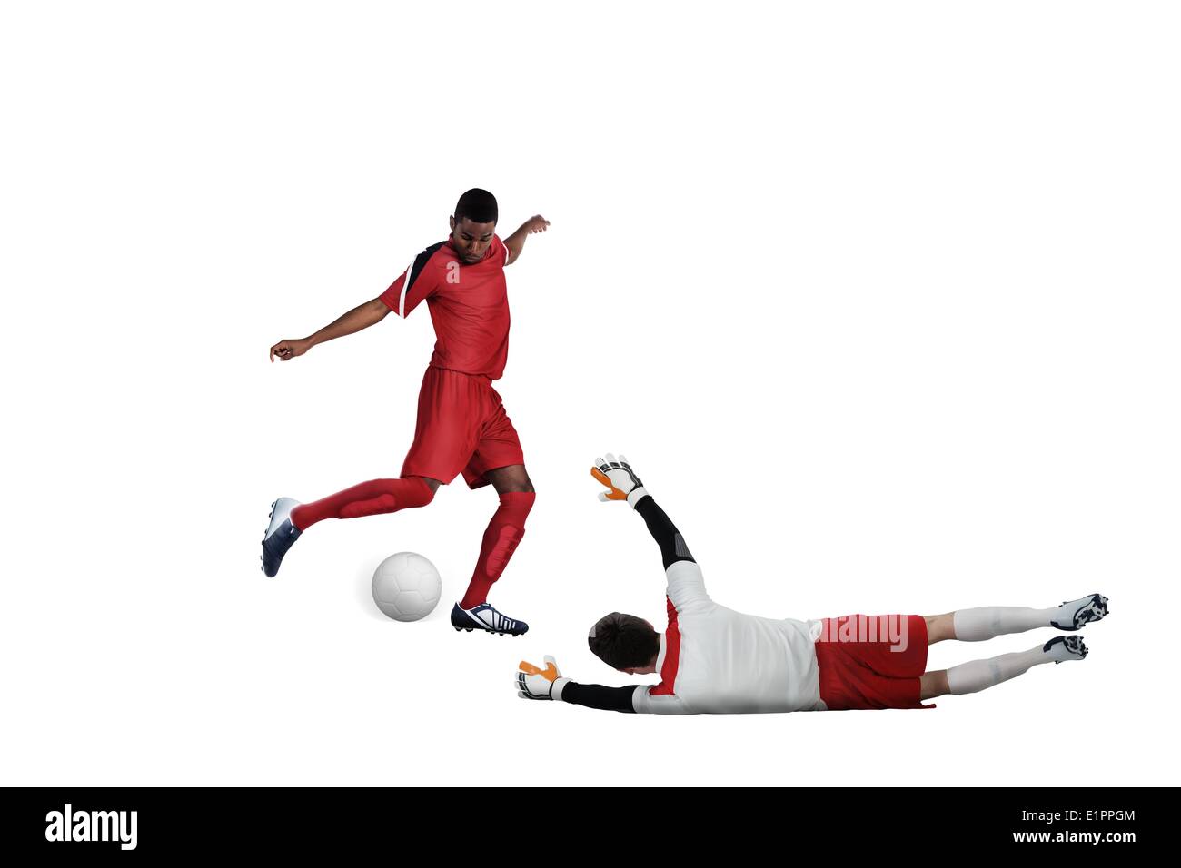 Football players tackling for the ball Stock Photo - Alamy