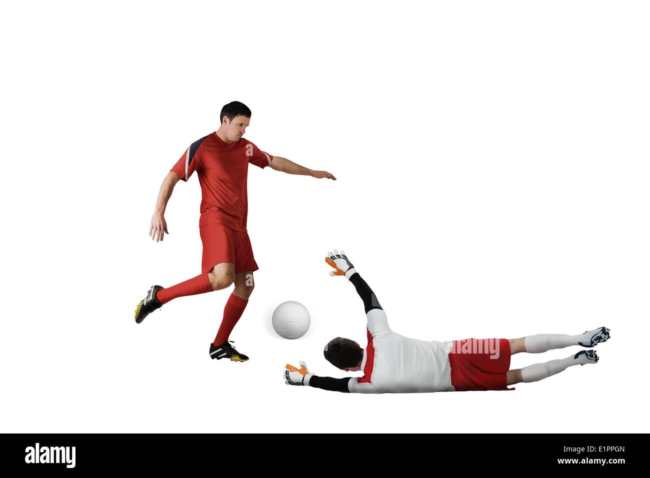 Football players tackling for the ball Stock Photo - Alamy
