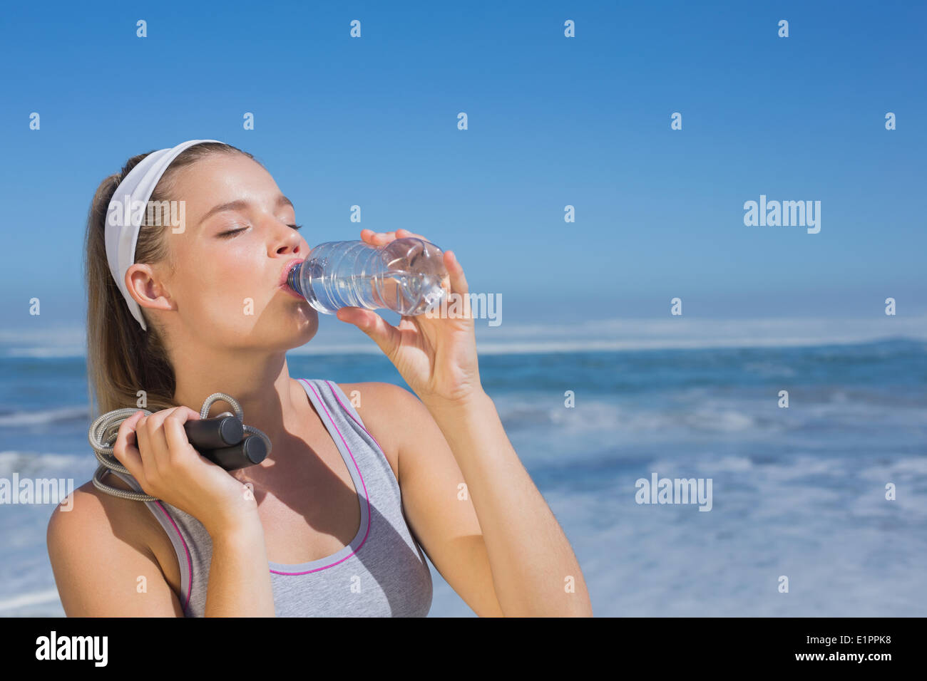 Woman skipping rope beach hi-res stock photography and images - Alamy