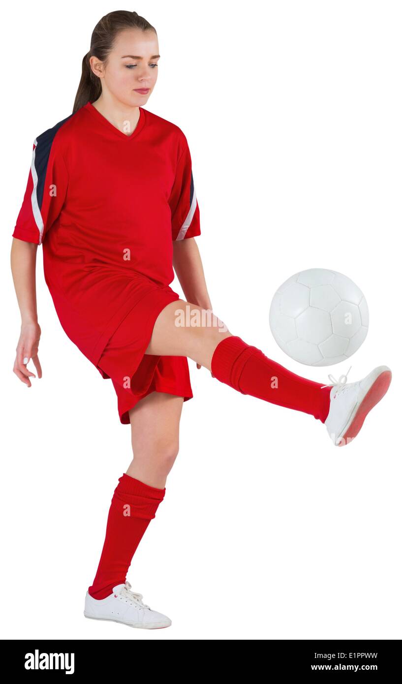 Cute football player kicking ball Stock Photo - Alamy