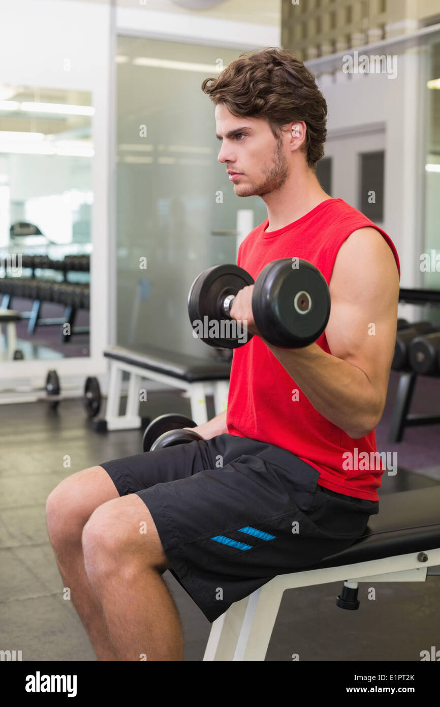 Muscular black man sitting hi-res stock photography and images - Alamy