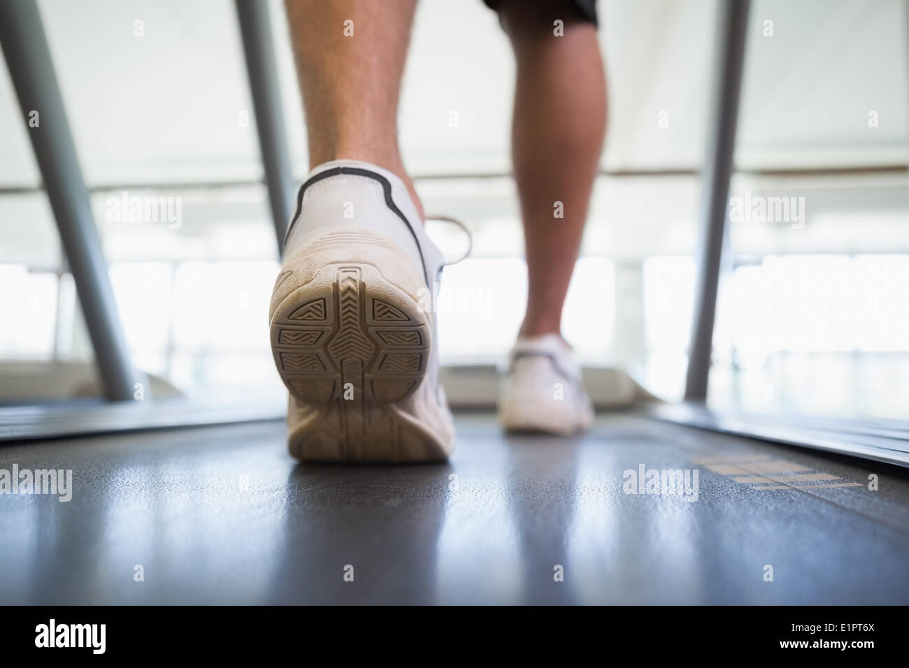 Man walking on the treadmill Stock Photo - Alamy