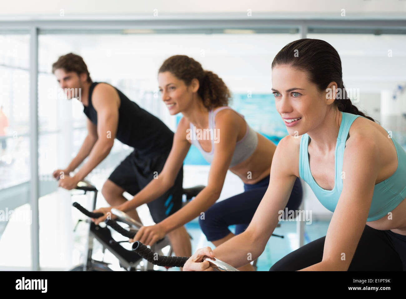 Fit people in a spin class Stock Photo - Alamy