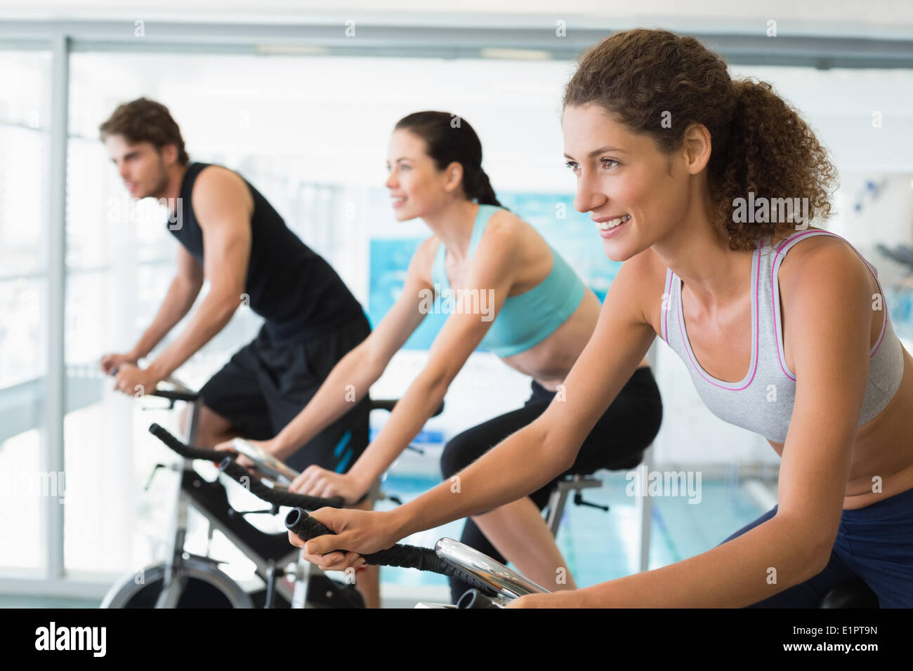 Fit people in a spin class Stock Photo - Alamy