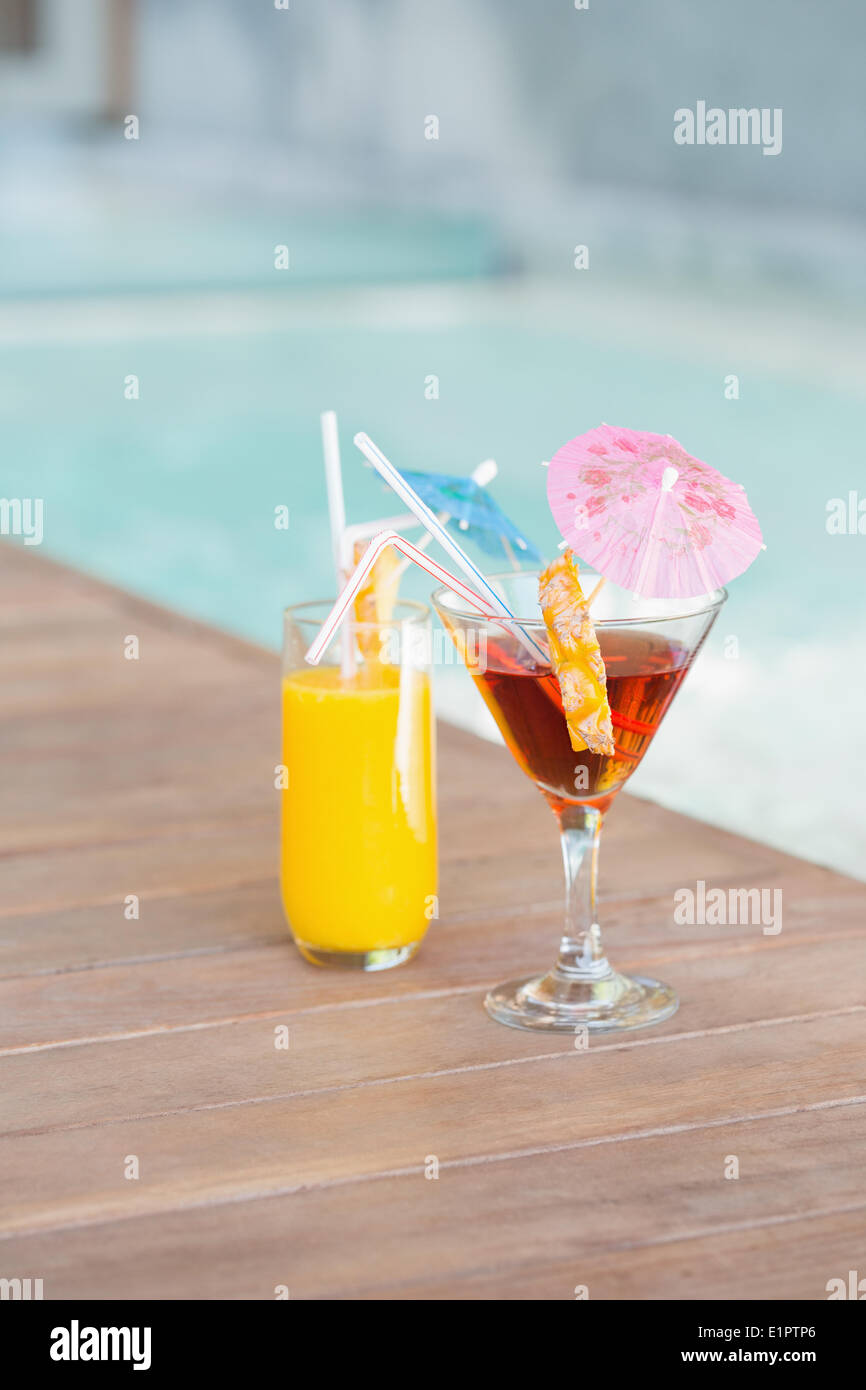 Two cocktails beside the swimming pool Stock Photo - Alamy