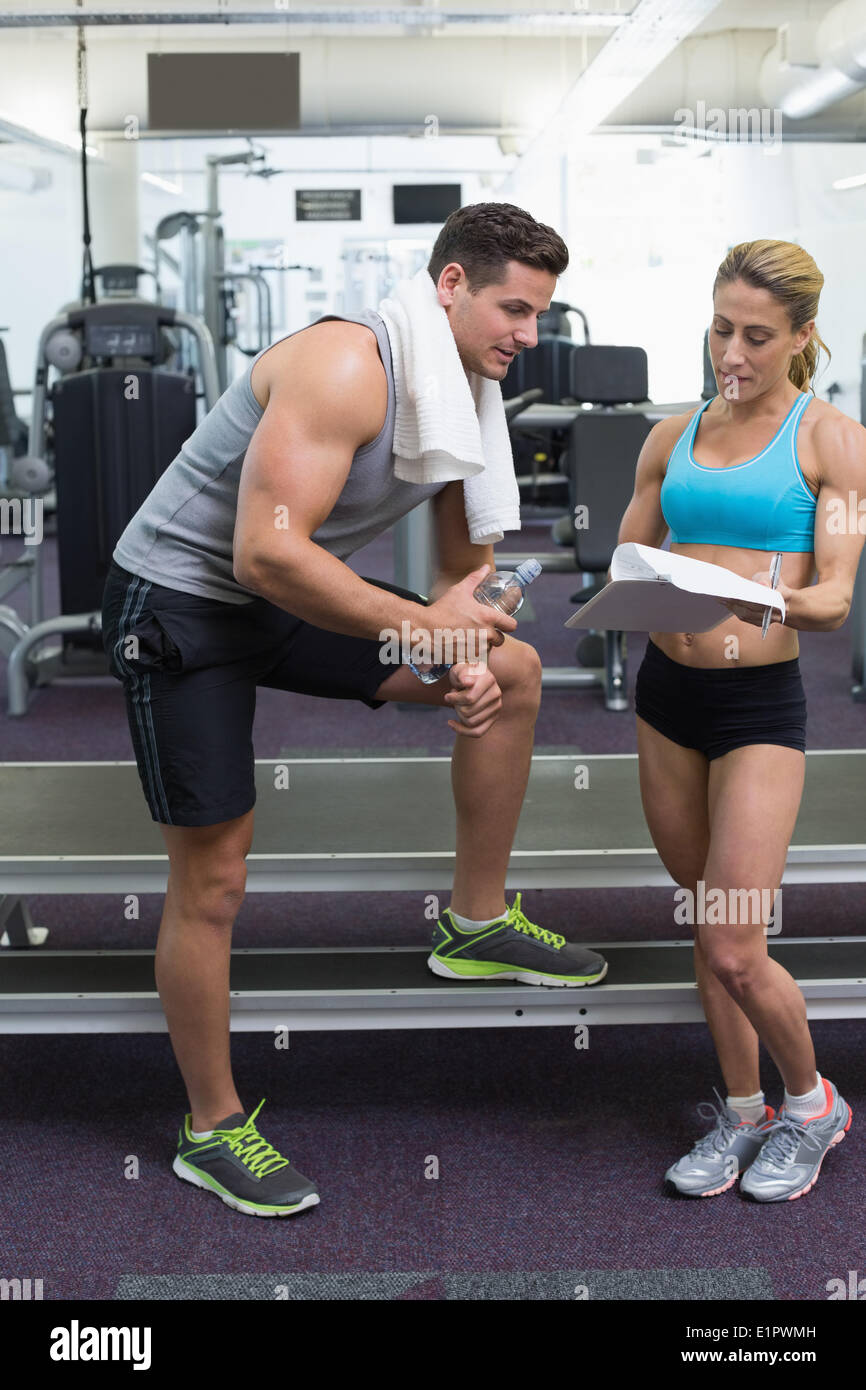 Bodybuilder talking with his personal trainer Stock Photo - Alamy